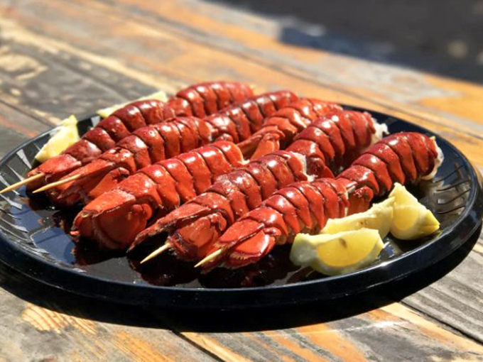 Lobster tails on skewers&mdash;nature's way of saying "here's the good stuff, no shell-cracking required." The lemon wedges aren't garnish; they're essential supporting actors.
