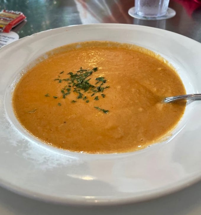 Rich, velvety lobster bisque that tastes like the ocean decided to give you a warm hug.
