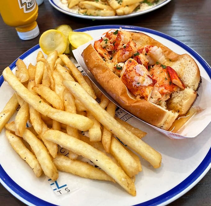 Lobster roll perfection: sweet meat tucked into a toasted bun with just enough butter to make you consider moving to New England.