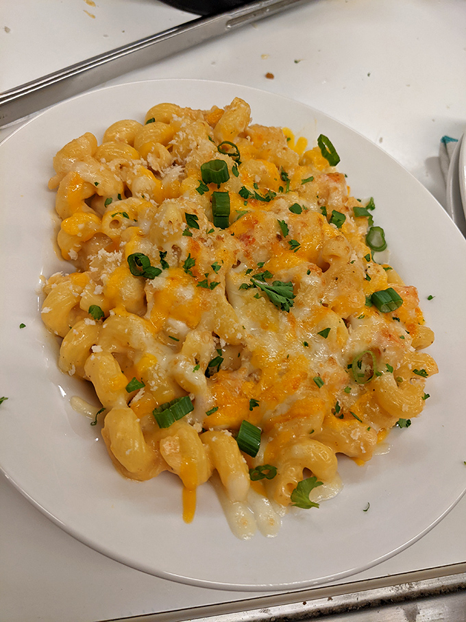 Mac and cheese elevated to an art form&mdash;creamy, cheesy, with a sprinkle of green onions adding just the right pop of color and flavor.