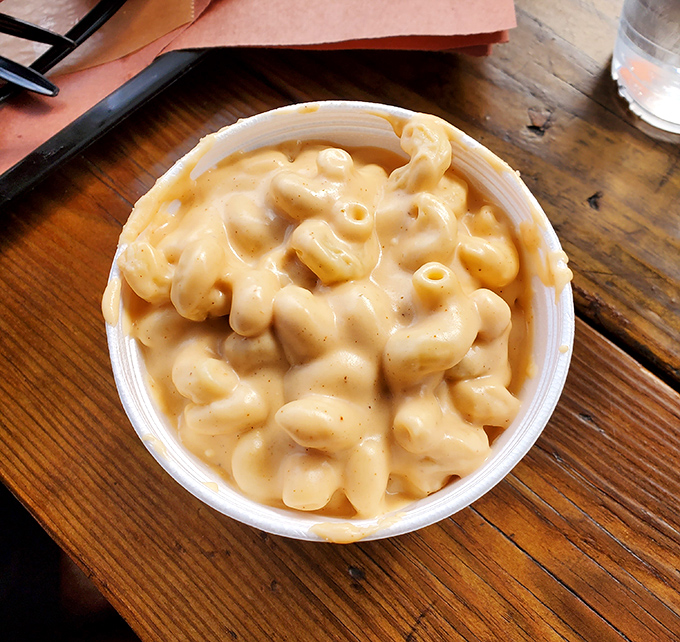 Mac and cheese that doesn't know it's a side dish. This creamy, dreamy concoction is staging a quiet revolution against the tyranny of meat-only barbecue plates.