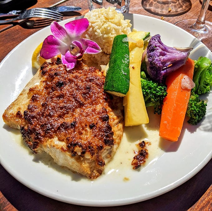 Panko-crusted perfection meets colorful vegetables that actually taste like themselves. That edible flower isn't just for show – it's confidence on a plate.