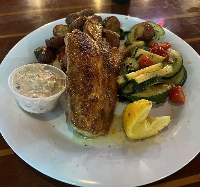 Mahi mahi gets the royal treatment here, dressed up in herbs and ready for its close-up.