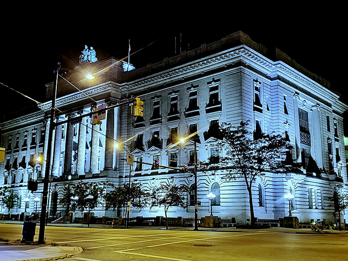 By night, this classical courthouse transforms into an illuminated masterpiece that makes even routine parking ticket payments feel like a grand civic occasion.