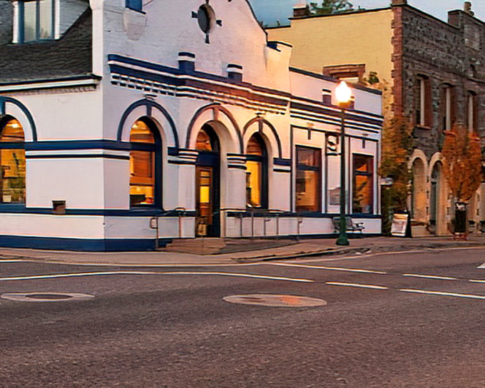 Mountain town's aerial view reveals neighborhoods nestled in autumn splendor like nature's own quilt.