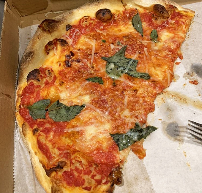 Margherita perfection in its purest form—the holy trinity of sauce, fresh mozzarella, and basil proves that sometimes less truly is more.