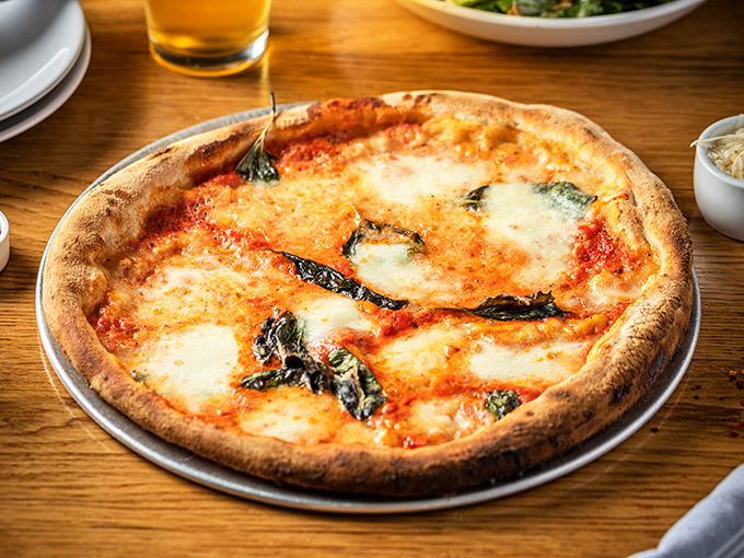 The Margherita pizza&mdash;proof that simplicity, when executed perfectly, is the highest form of culinary art. Those char spots are flavor freckles!