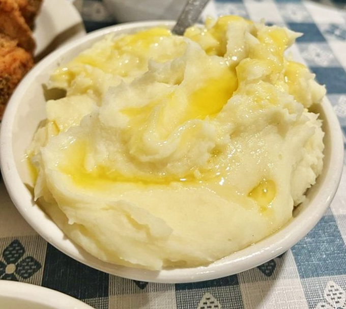 Creamy mashed potatoes with a pool of butter that would make your cardiologist nervous and your soul happy.