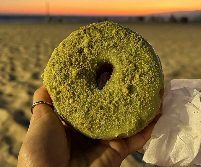 Matcha made in heaven! This vibrant green donut brings a touch of zen to your sugar rush, perfect against the sunset backdrop.