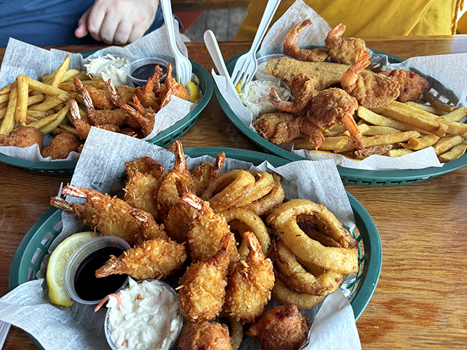 Three baskets of golden-fried treasures from the deep. The kind of feast that makes you glad stretchy waistbands were invented. 
