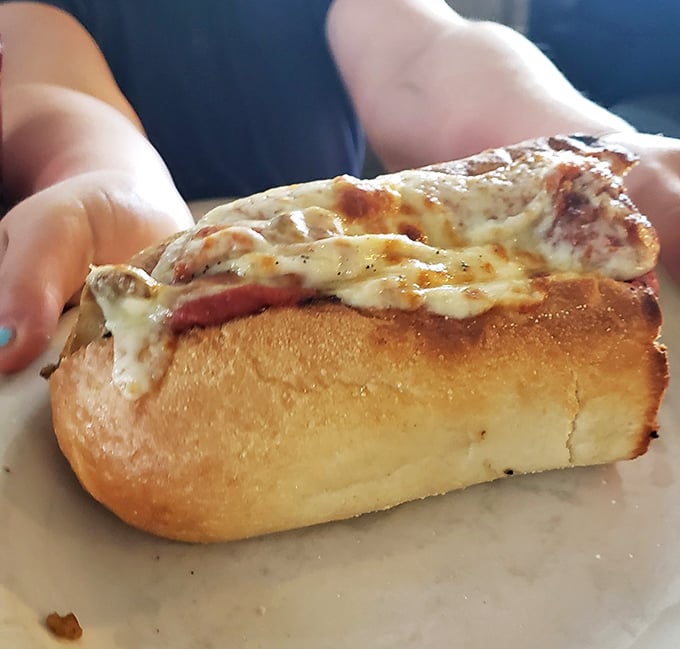 The meatball sub that launched a thousand napkins. That golden-toasted bun cradles its saucy cargo like it was born for this purpose.