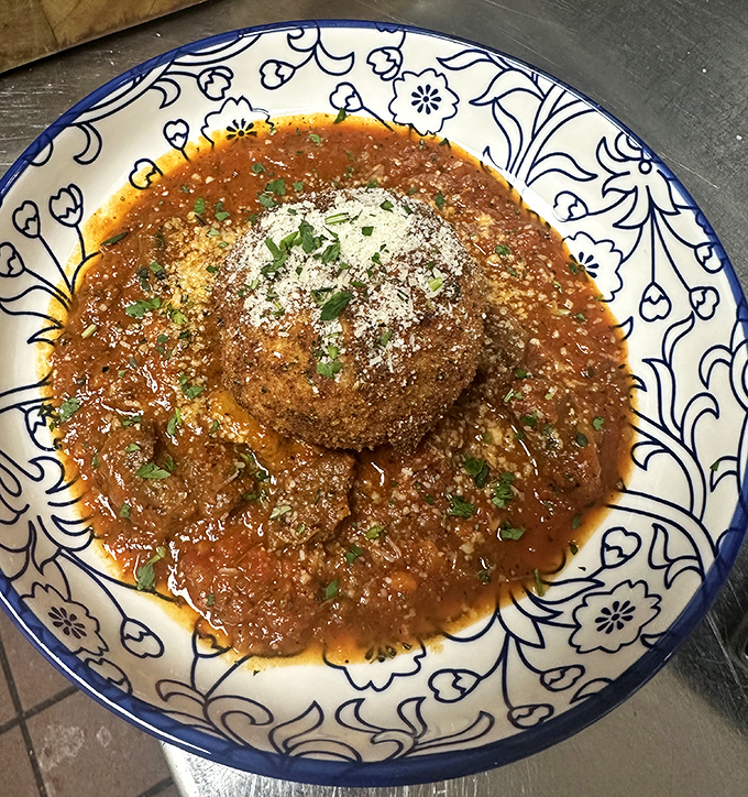 These meatballs aren't just food; they're time machines to Sunday dinners at an Italian grandmother's house you wish you had grown up in.