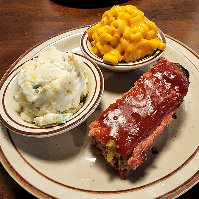 Meatloaf, mac and cheese, and potato salad: the holy trinity of comfort food executed with the precision of a NASA launch.