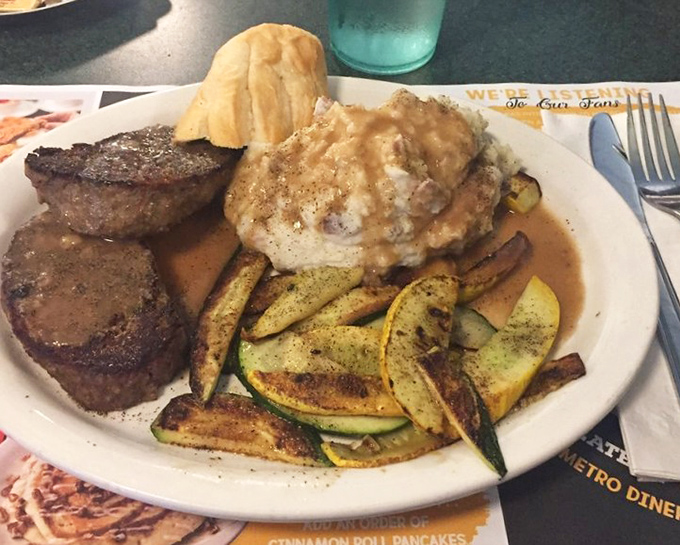 Meatloaf, biscuit, and seasoned veggies sharing a plate like old friends at a reunion. Comfort food that doesn't need a fancy introduction.