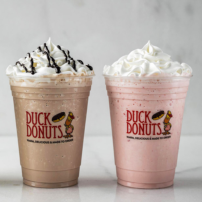 These milkshakes bring all the joy to the yard. One chocolate, one strawberry, both topped with clouds of whipped cream that defy gravity.