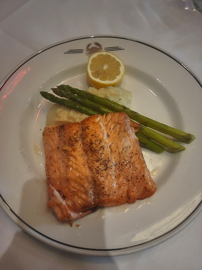 Salmon so perfectly cooked it makes you wonder if Neptune himself is working the kitchen. Those asparagus spears stand at attention in approval.