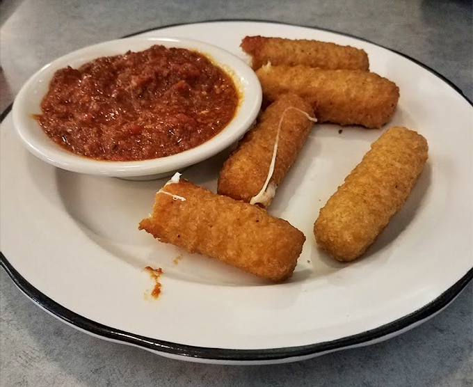 These aren't just mozzarella sticks&mdash;they're crunchy vessels of molten cheese joy, waiting to be dunked in that vibrant marinara sea.
