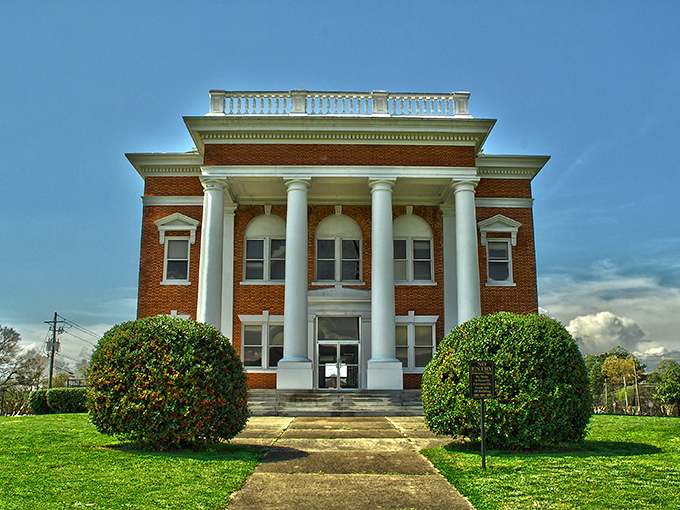 The Murray County Courthouse stands proudly with its stately columns and symmetrical design—small-town America's architectural exclamation point.