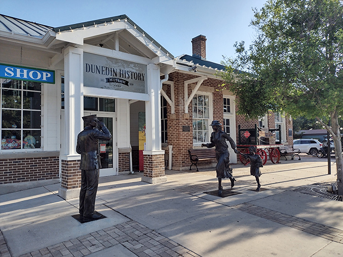 The Dunedin History Museum's entrance features bronze figures frozen in time, silently telling stories of the town's past while you contemplate your ice cream choice.