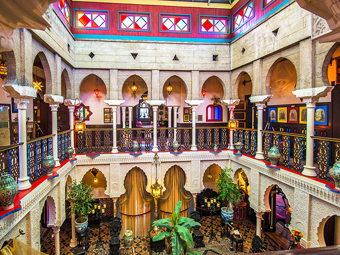 The Court of Lions reveals itself in all its glory&mdash;a two-story atrium where horseshoe arches, intricate balustrades, and colorful tiles create a space that defies Florida's zip code.