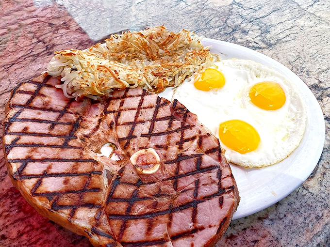 This ham steak and eggs plate isn't just breakfast &ndash; it's fuel for champions, a protein-packed powerhouse that says "today is going to be extraordinary."
