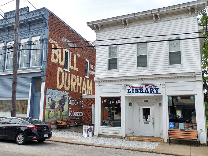 The Bull Durham advertisement alongside Nauvoo's library proves that even small towns understand the importance of both good literature and quality tobacco. 