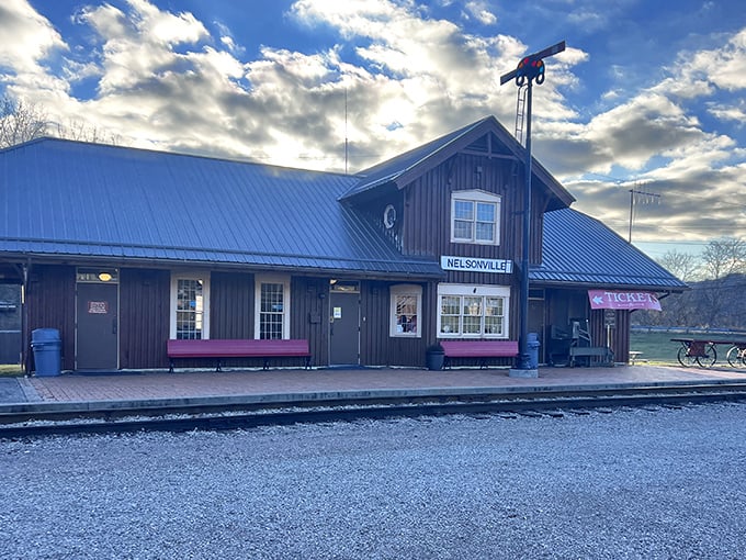 Not just a building but a portal to the past. Nelsonville Depot's rustic charm and metal roof have welcomed travelers through sunshine and rain.
