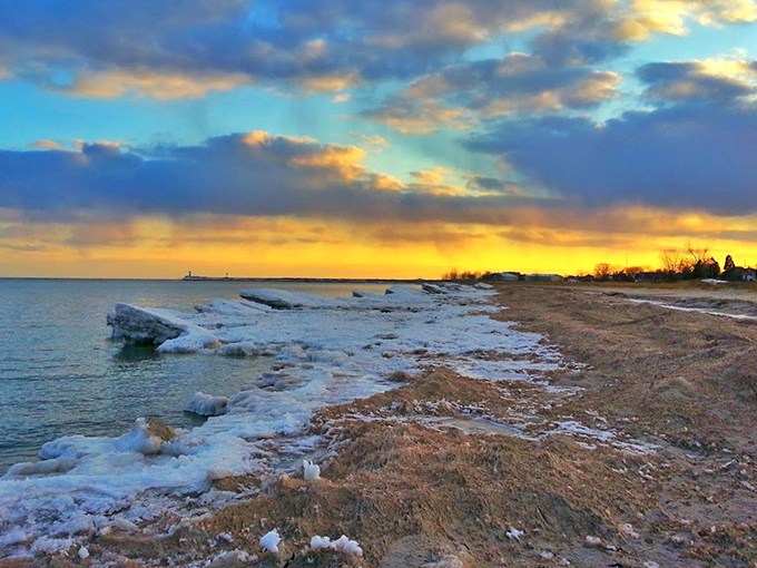 Winter transforms Lake Michigan's shoreline into a breathtaking arctic landscape where golden sunsets battle ice formations for visual supremacy.