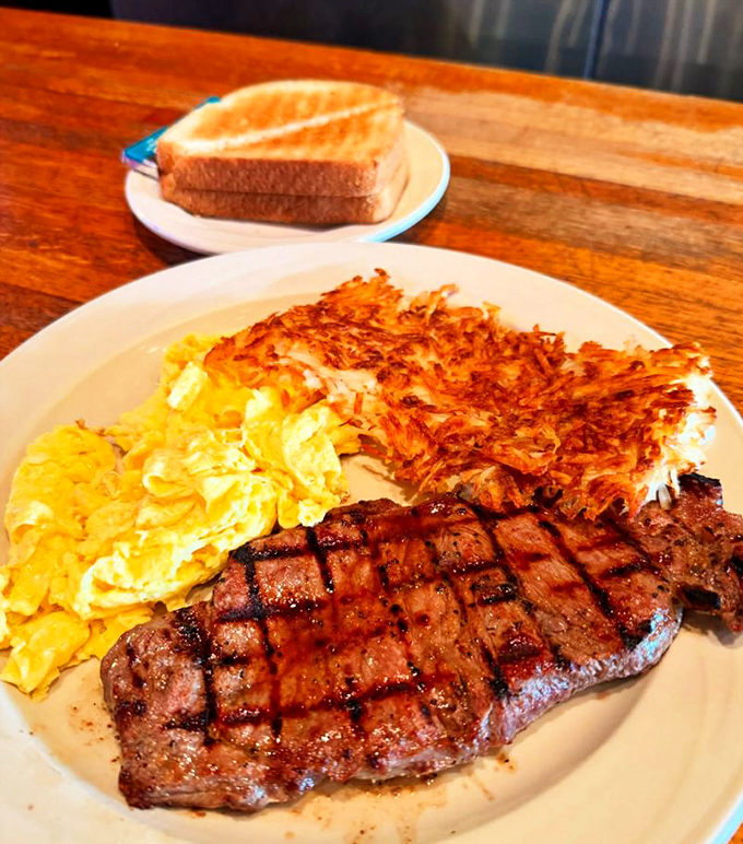 The perfect trifecta: a beautifully grilled steak, golden hash browns with the ideal crisp-to-soft ratio, and eggs that would make any chicken proud.