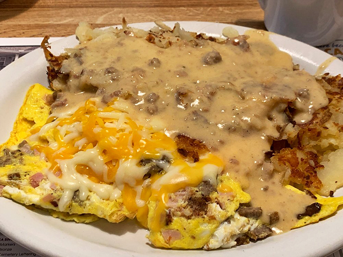 This isn't just an omelet&mdash;it's a cheesy, meaty masterpiece smothered in country gravy that would make your cardiologist frown and your taste buds sing.