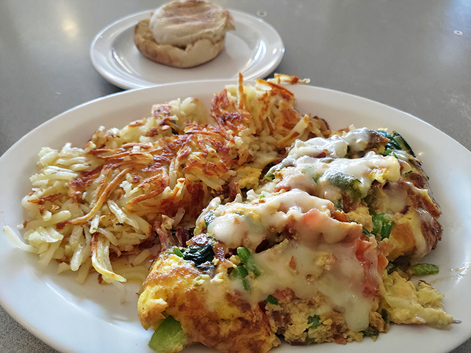 This colorful omelet bursts with fresh ingredients, proving that breakfast done right can be a work of edible art.