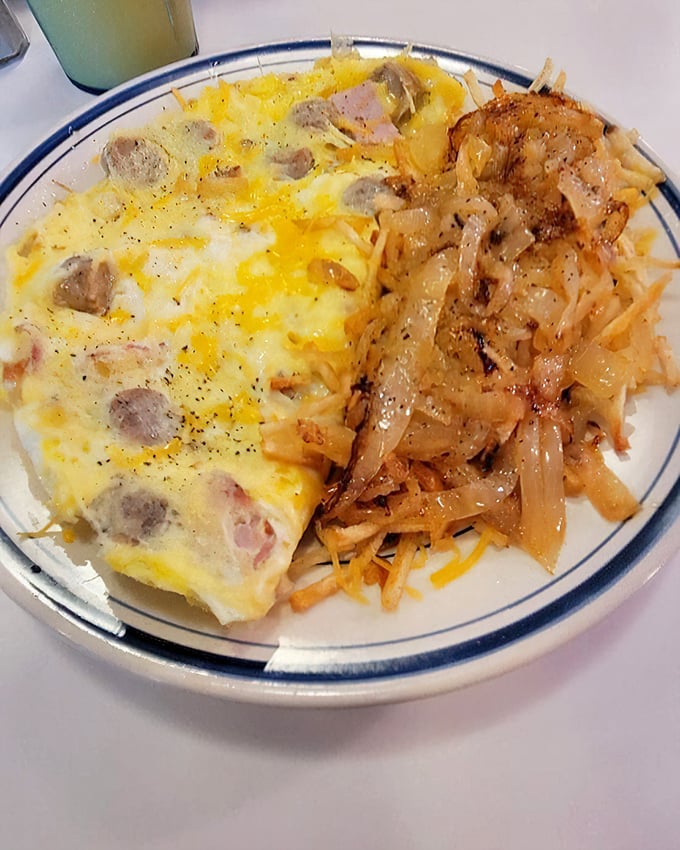Behold the perfect marriage &ndash; a ham and cheese omelet that's actually fluffy, paired with hash browns crisped to golden perfection. Breakfast diplomacy at its finest.