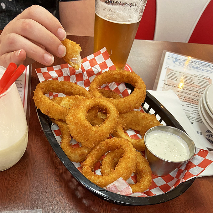 Golden halos of crispy perfection. These onion rings aren't just side dishes&mdash;they're edible jewelry that crunch like autumn leaves and taste like summer carnivals.