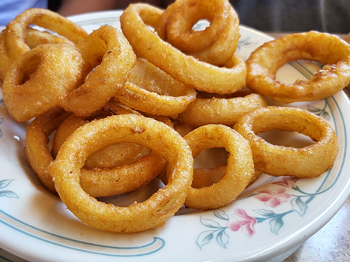 Golden onion rings with the perfect crunch-to-tenderness ratio &ndash; the kind that make you wonder why anyone bothers with fancy appetizers.