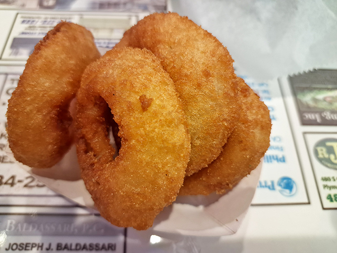 Golden, crispy onion rings that shatter with each bite. The perfect sidekick to a cheesesteak, like Robin to Batman, only tastier.