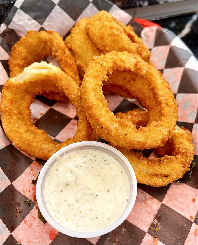 Onion rings with the perfect crunch-to-give ratio—that magical moment when the coating shatters but still clings to its sweet, tender center.