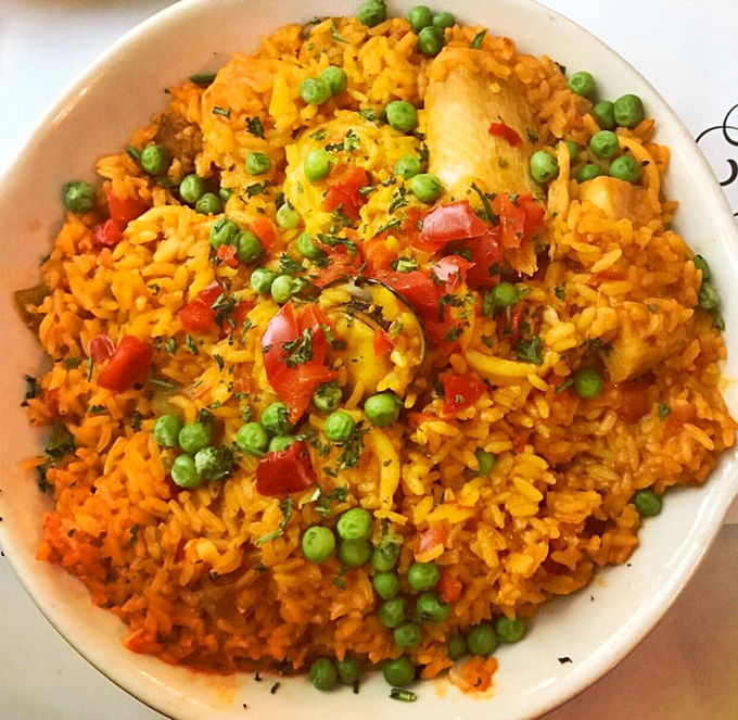 Sunshine on a plate! This vibrant yellow rice studded with peas, peppers, and chicken is Miami's answer to a gray day.
