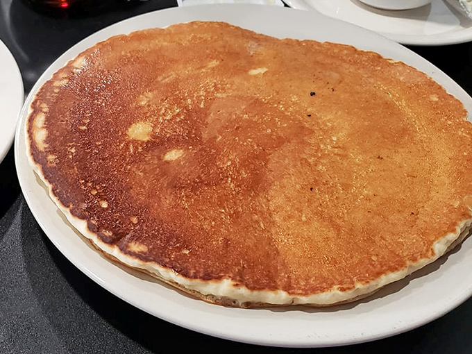 The pancake that ate Pittsburgh. Golden, perfectly browned, and taking up real estate on the plate like it's paying rent.