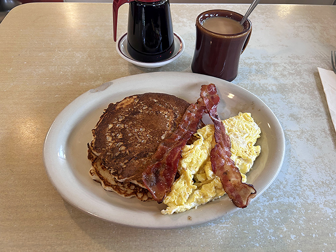 Pancakes shouldn't wear jewelry, but this one sports a bacon bracelet and egg brooch that would make breakfast royalty jealous.