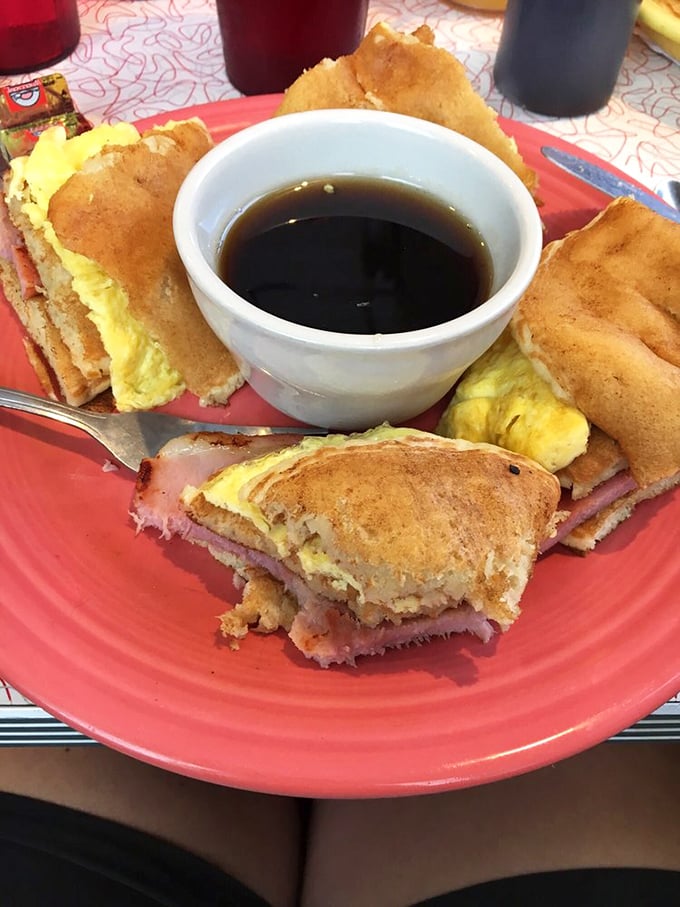 This breakfast sandwich isn't just a meal&mdash;it's an architectural achievement with layers of ham, egg, and toast surrounding a syrup dipping pool.