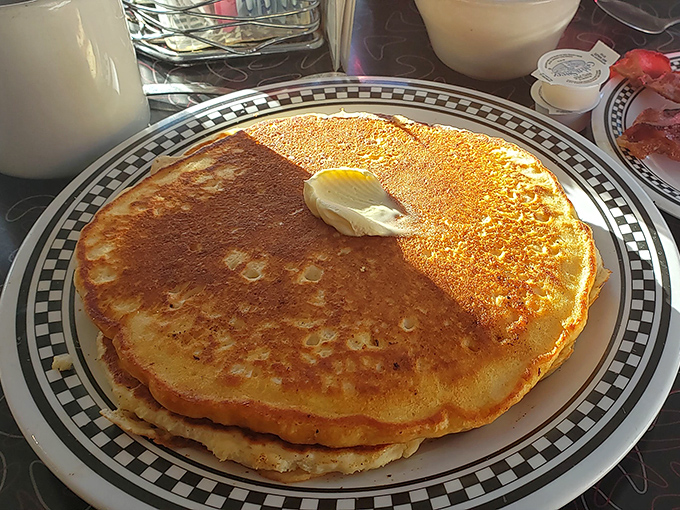 Pancakes the size of hubcaps, golden-brown and waiting for that pat of butter to melt into a pool of breakfast bliss.