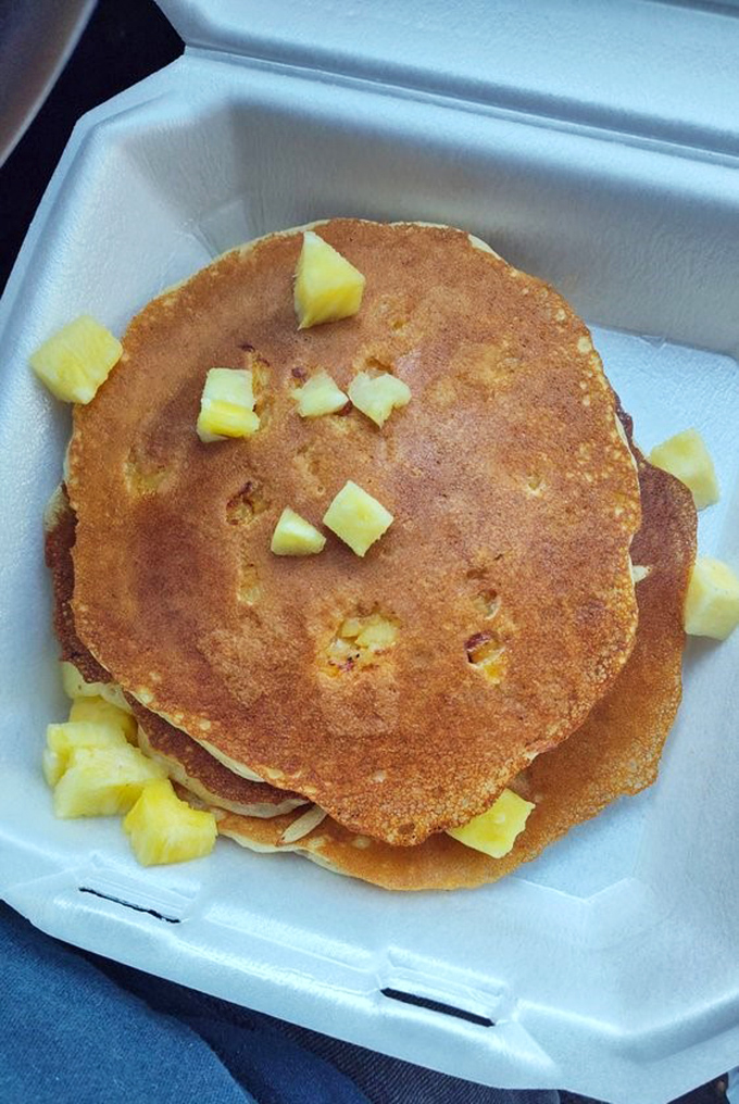 Fluffy pancakes stacked like edible clouds, ready to make your morning absolutely perfect and memorable.