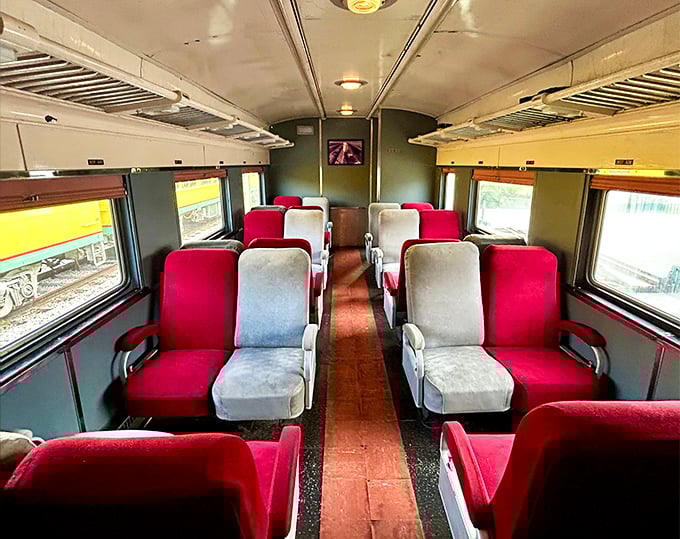 Red and white seats invite passengers to settle in for the journey, offering comfort with a dash of mid-century design that would make Don Draper nod approvingly.
