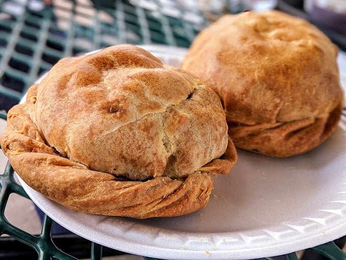 Two golden beauties ready for devouring. The distinctive crimped edge isn't just tradition &ndash; it's the original "handle" that allowed miners to hold their lunch with coal-dusted hands.