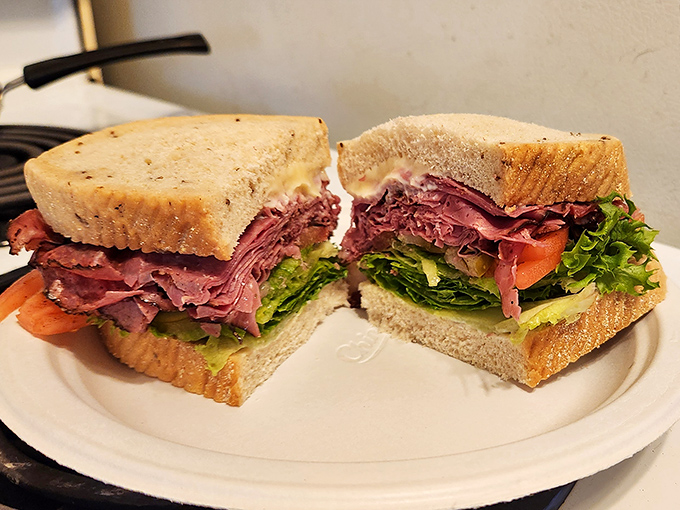 This pastrami sandwich is what deli dreams are made of - thick, tender, and absolutely unapologetic.
