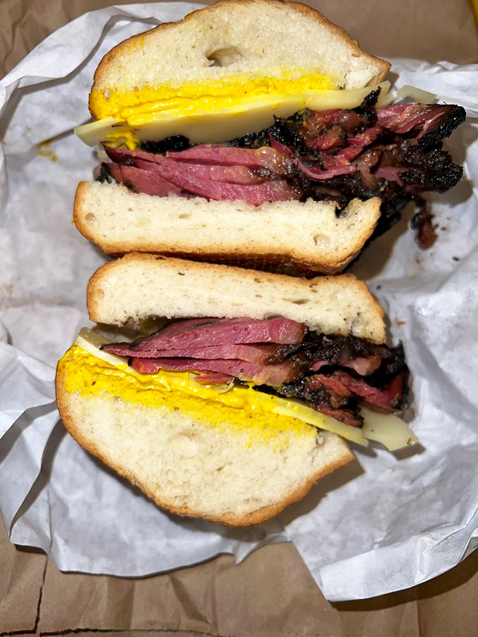 This pastrami sandwich isn't playing games &ndash; it's a skyscraper of meat with mustard that means business and bread that knows its supporting role.