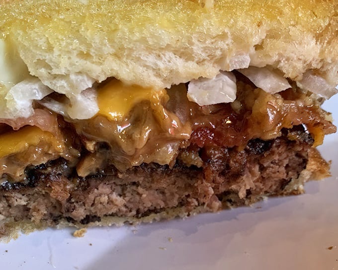 The cross-section reveals the truth&mdash;this isn't just a patty melt, it's a carefully orchestrated symphony of beef, cheese, and what appears to be peanut butter. Culinary courage at its finest.