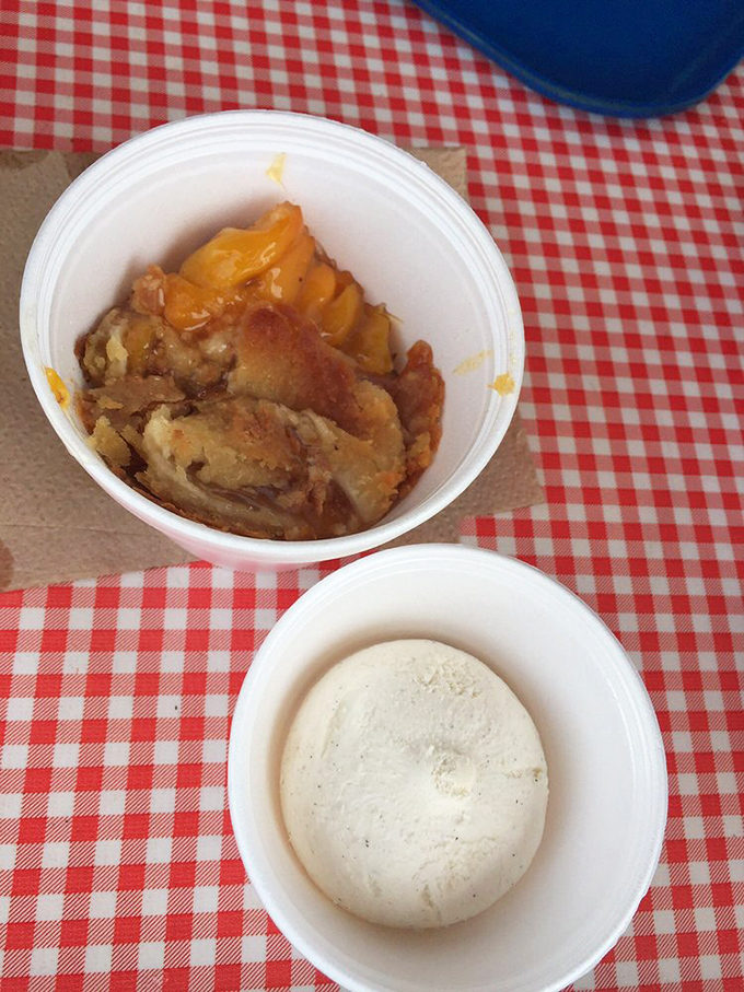 Peach cobbler and ice cream: where fruit meets fire in a dessert that would make your grandmother both proud and jealous.