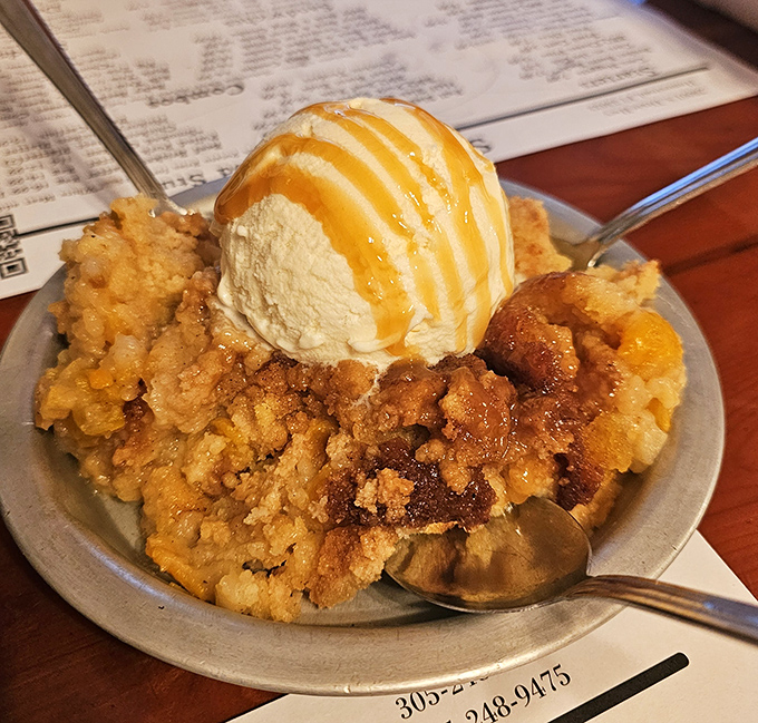 This peach cobbler with ice cream isn't dessert—it's the grand finale to a barbecue symphony. The standing ovation is automatic.