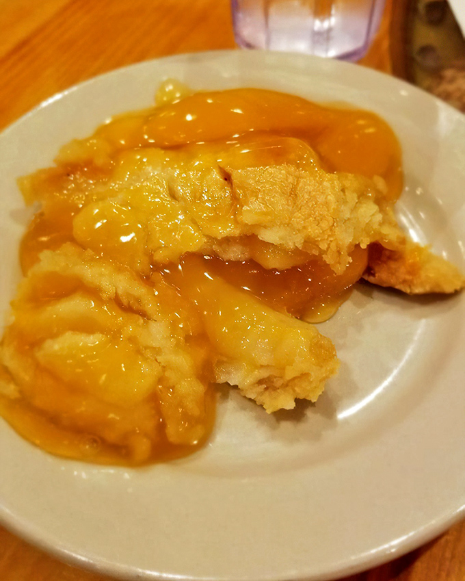 This isn't just dessert; it's Southern comfort in edible form. Warm, gooey peach cobbler that would make your grandmother both proud and jealous.
